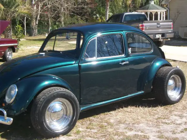 1967 VW Bug with a 460 Ford motor in the front.