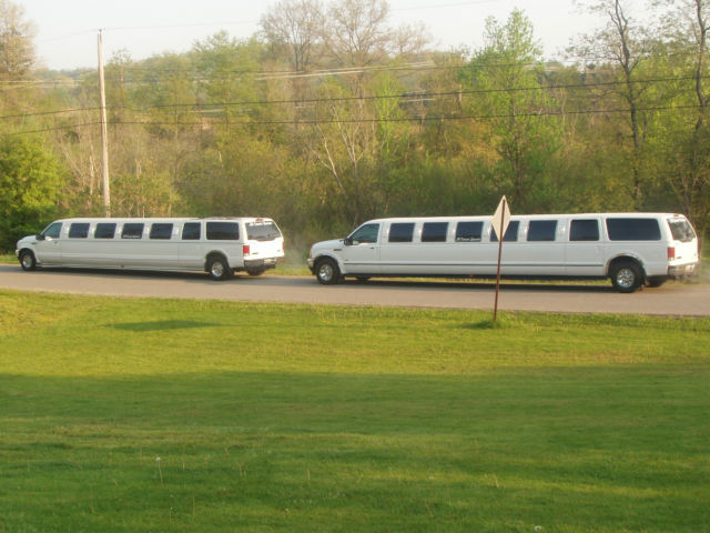 White (pair) 24 Passenger 220 Stretch SUV Limousines